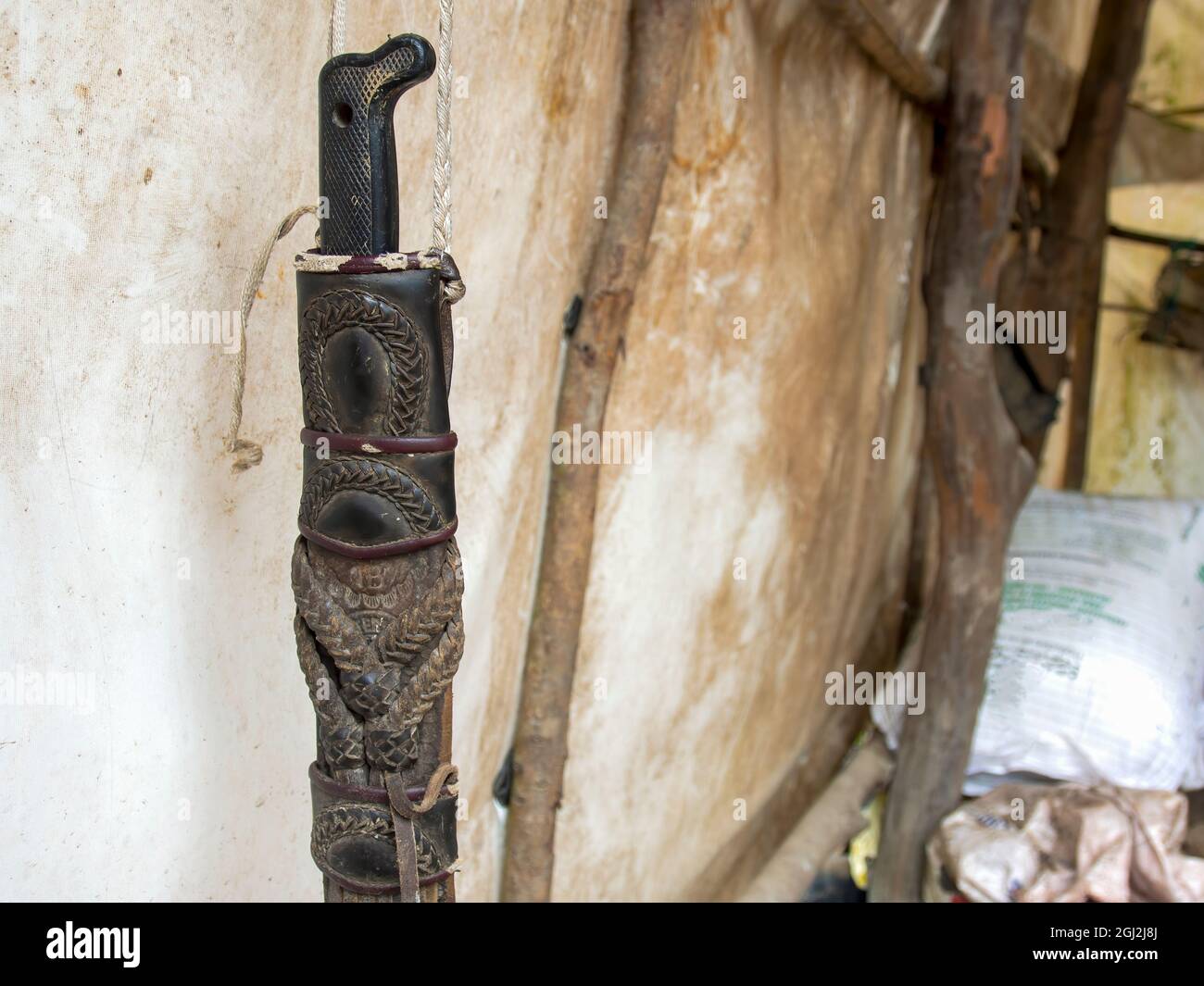 A typical colombian machete in its richly decorated leather holster ...