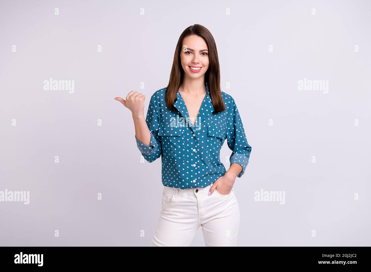 Photo of optimistic brunette hair young lady point empty space wear ...