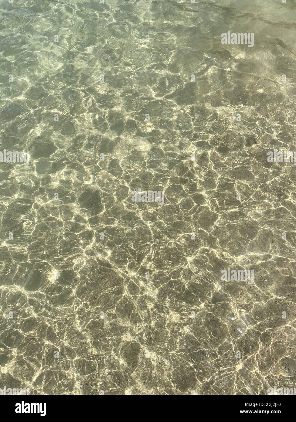 Crystal clear water in Quemado beach in al hoceima Stock Photo - Alamy