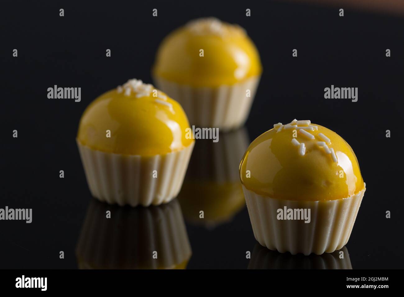 Delicious mini glazed sweets with lemon Stock Photo - Alamy