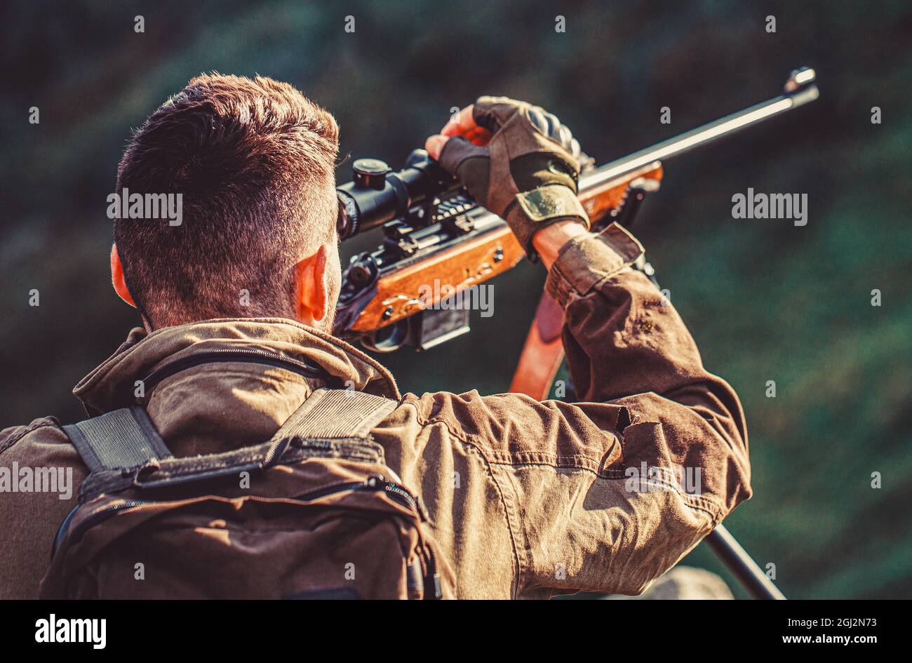 Hunting period. Male with a gun. Close up. Hunter with hunting gun and ...