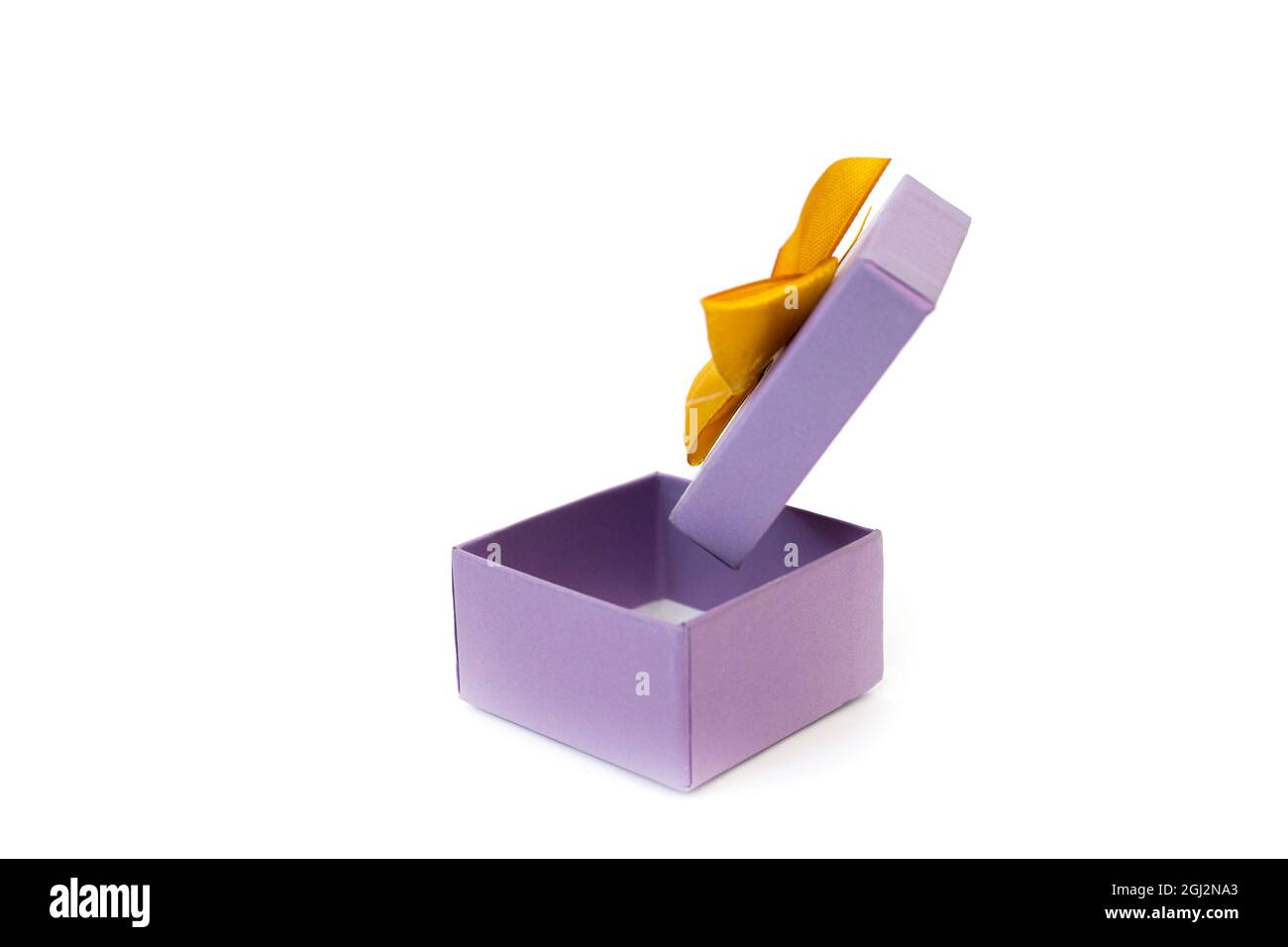 Blank open purple gift box with yellow ribbon bow isolated on white ...