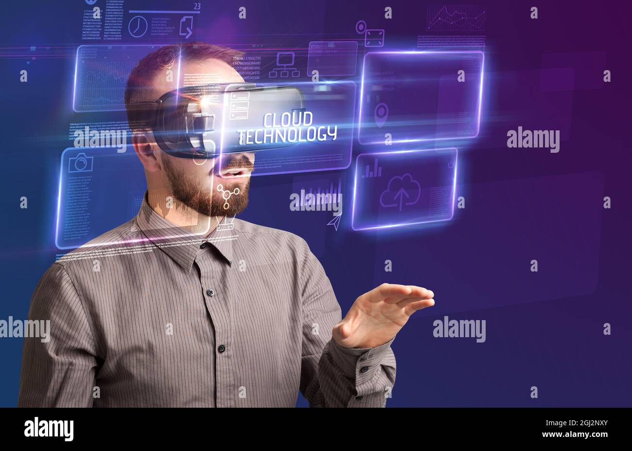Businessman looking through Virtual Reality glasses, tech concept Stock ...