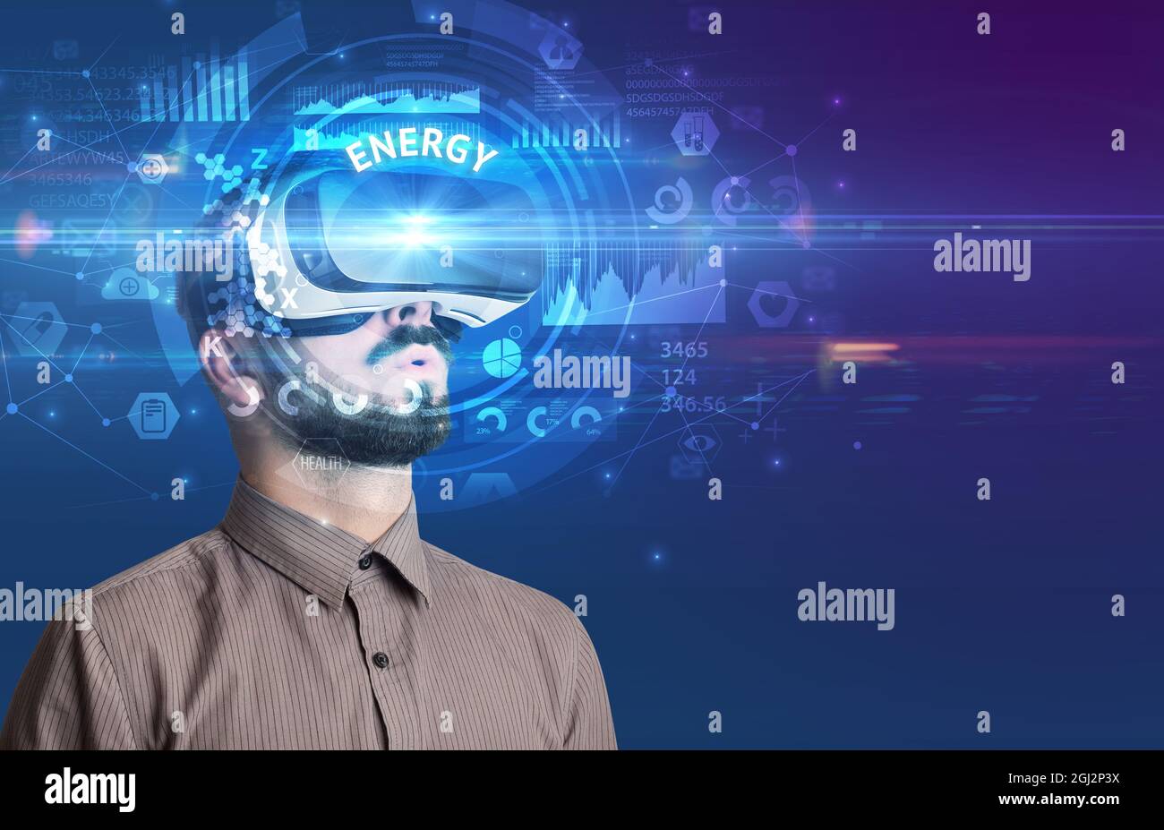 Businessman looking through VR glasses Stock Photo - Alamy