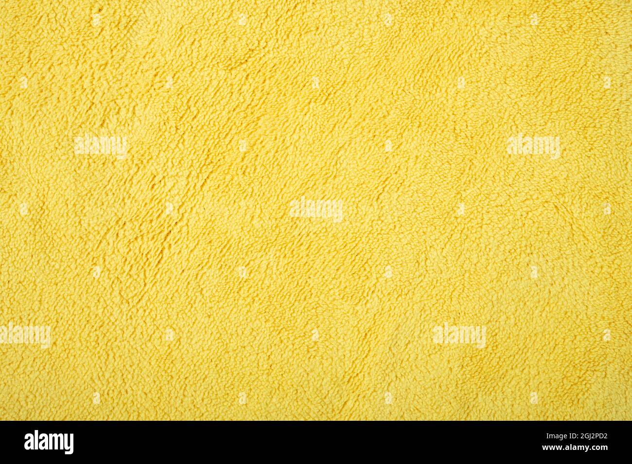 yellow fluffy cloth for cleaning as background and texture Stock Photo ...