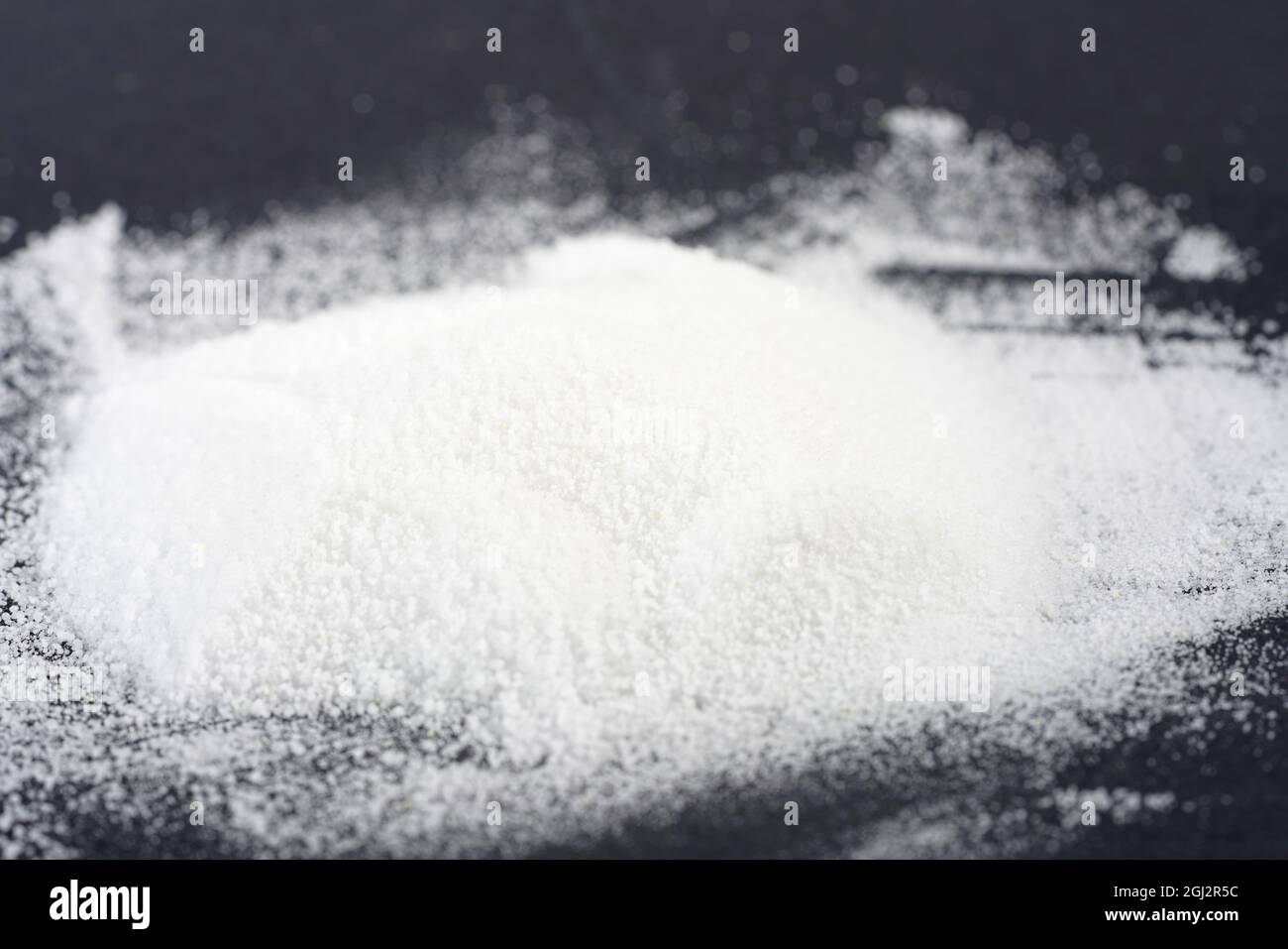 Flour with macro lens photographed against colorful gradient in studio ...