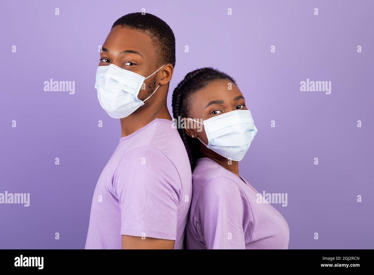 Young black couple wearing protective face masks on, African American ...