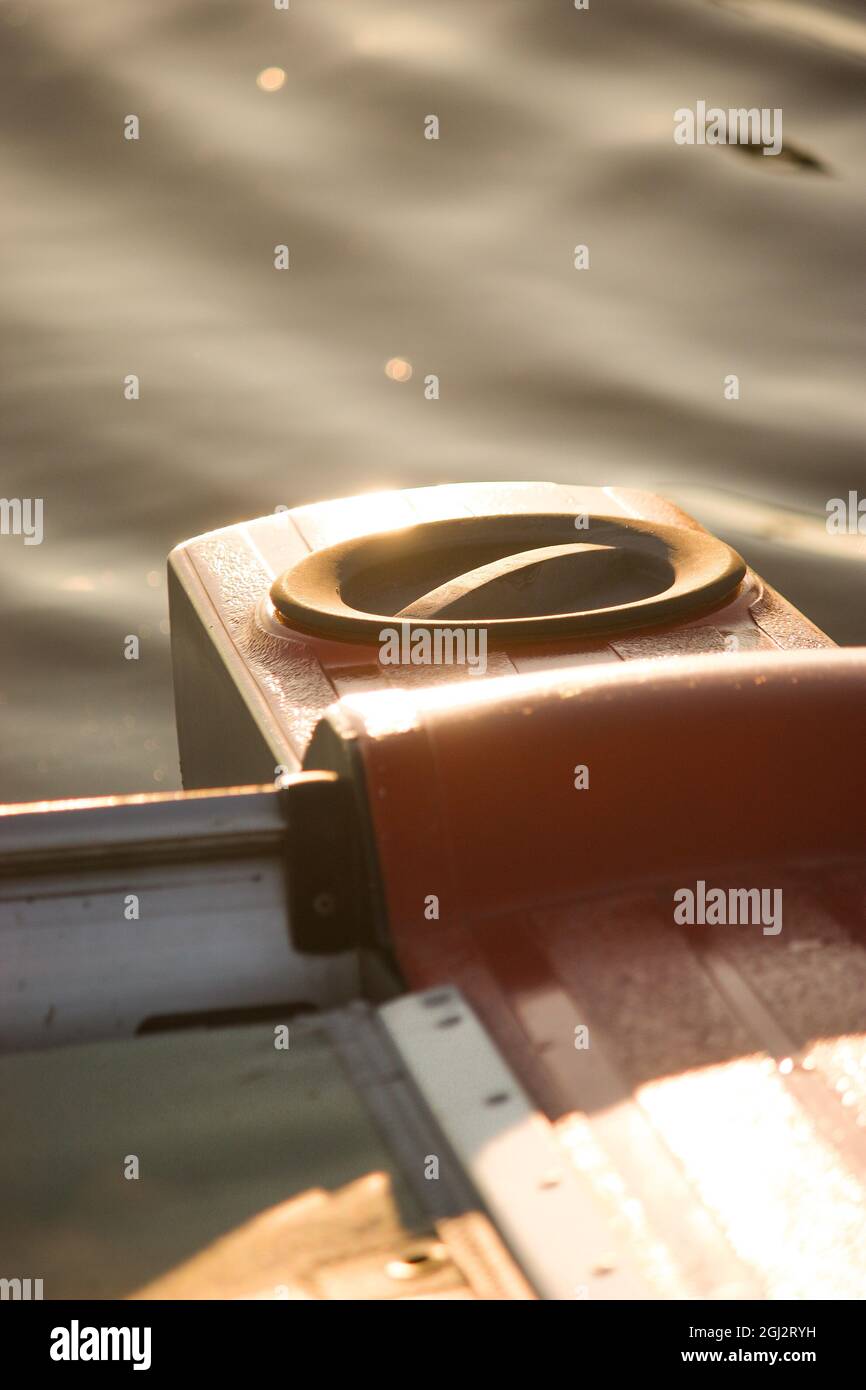 Vertical shot of the stern part of a catamaran on a background of water ...