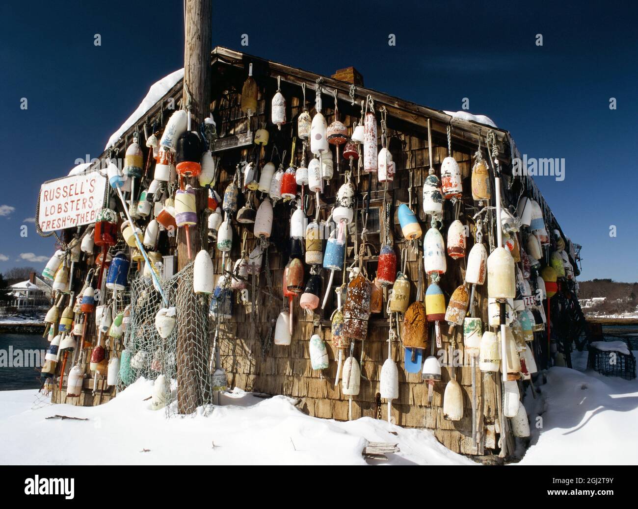 Maine lobster shack with buoys in winter Stock Photo - Alamy