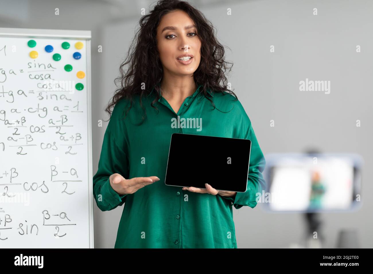 Modern Distance Learning. Female math teacher making video conference ...