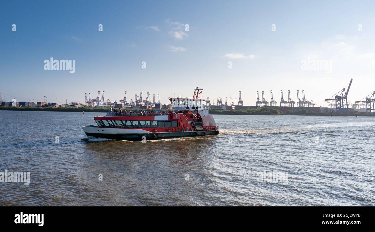 Ferry ship for commuters and tourist at the harbor of Hamburg, Germany ...