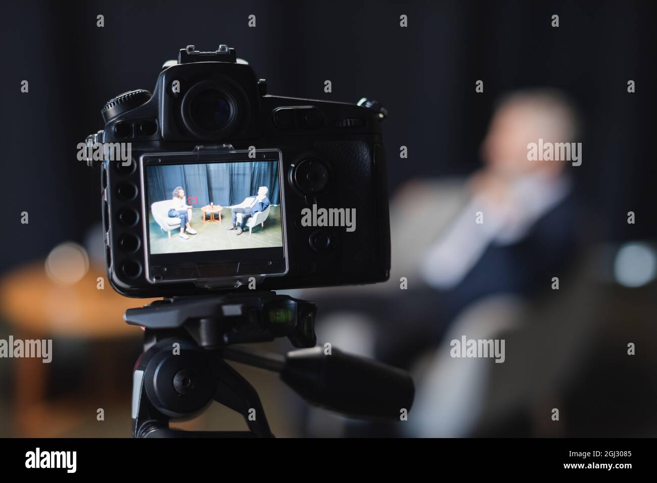 digital camera with african american journalist talking with ...
