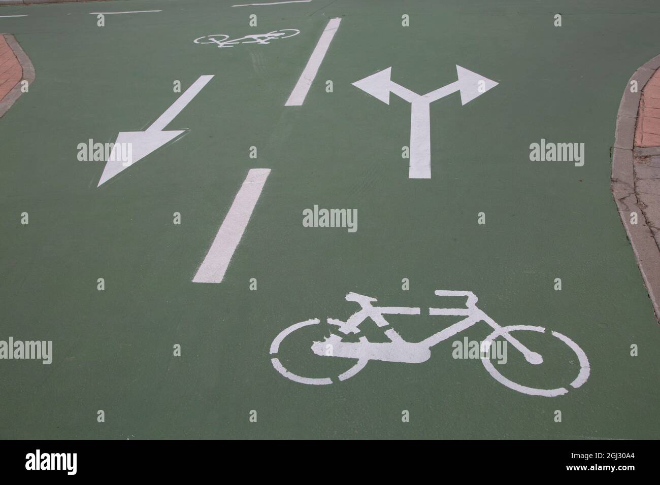 Bike Path with Symbol Sign and Arrow Stock Photo - Alamy