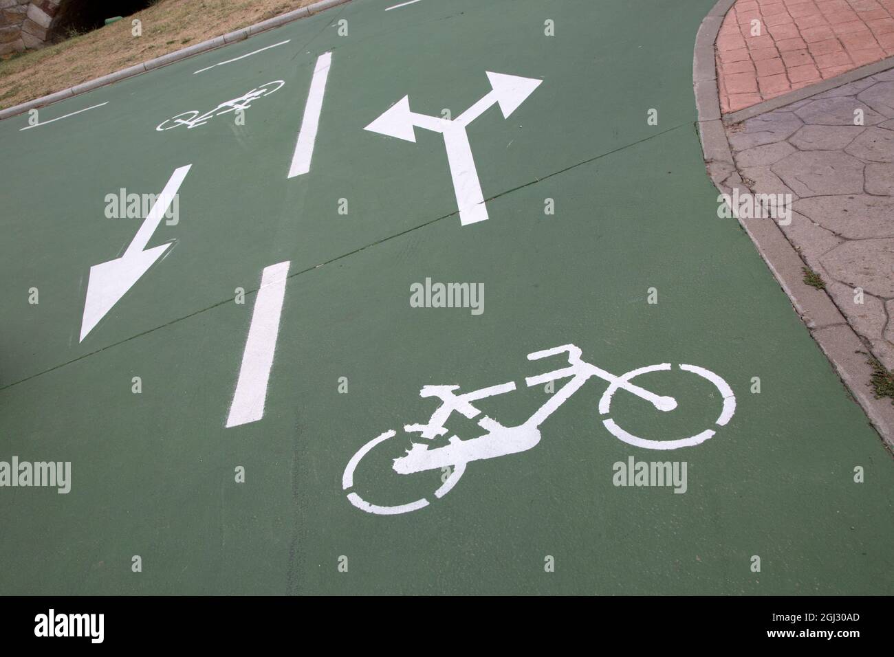 Bike Path Symbol Sign with Arrow Stock Photo - Alamy