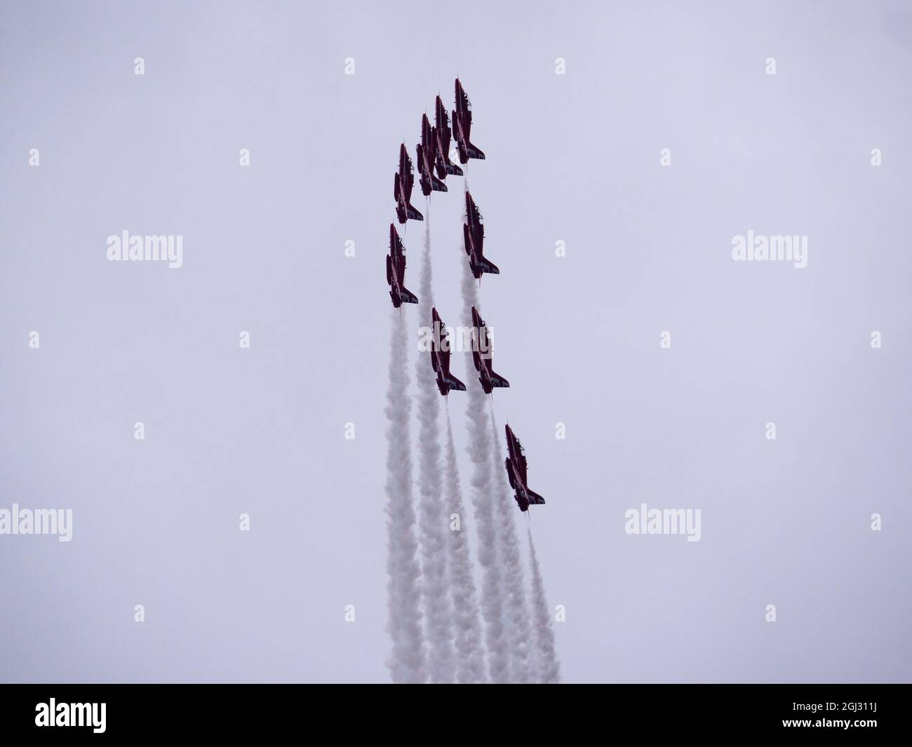 Red Arrows display team in tight formation in banked turn at ...