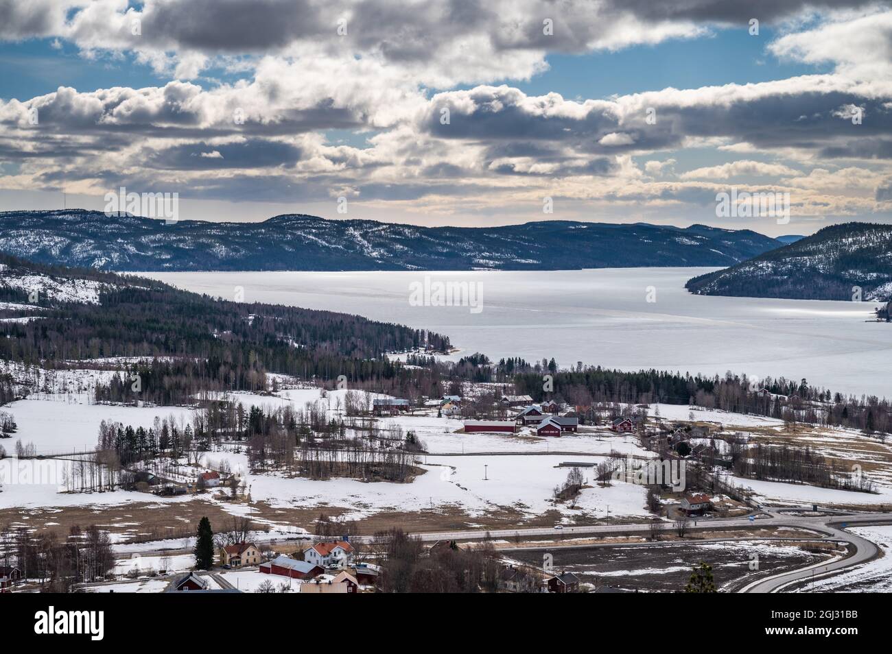 Winter landscape scene with forest, snow covered pine trees and seaside ...