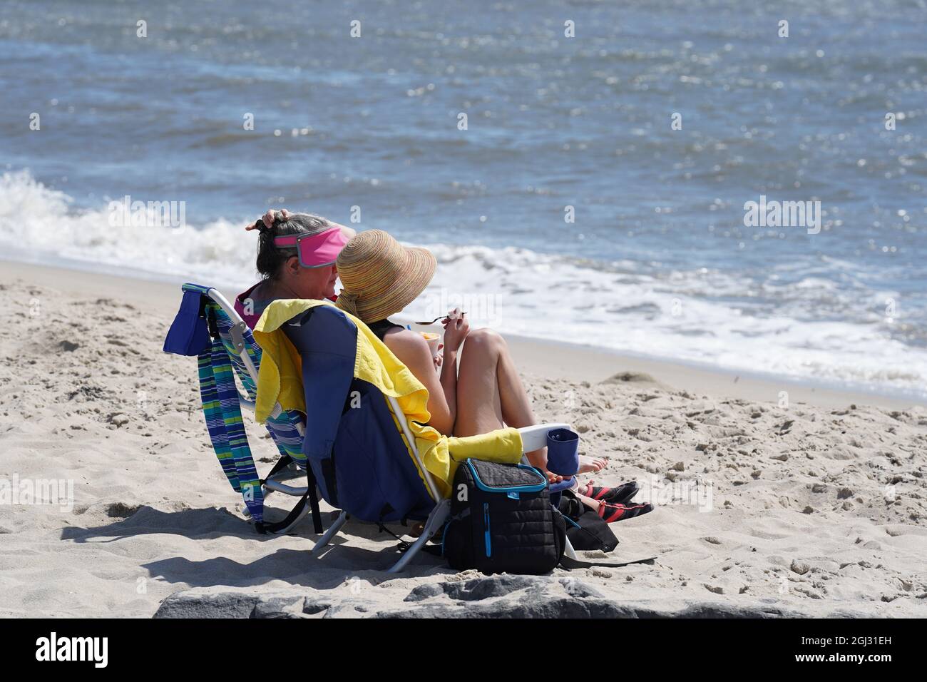 Ladies Tanning On The Beach