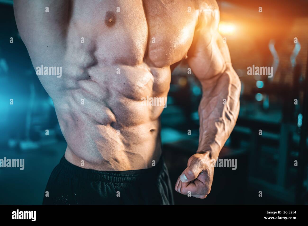 closeup of muscular bodybuilder man with perfect body have workout in ...