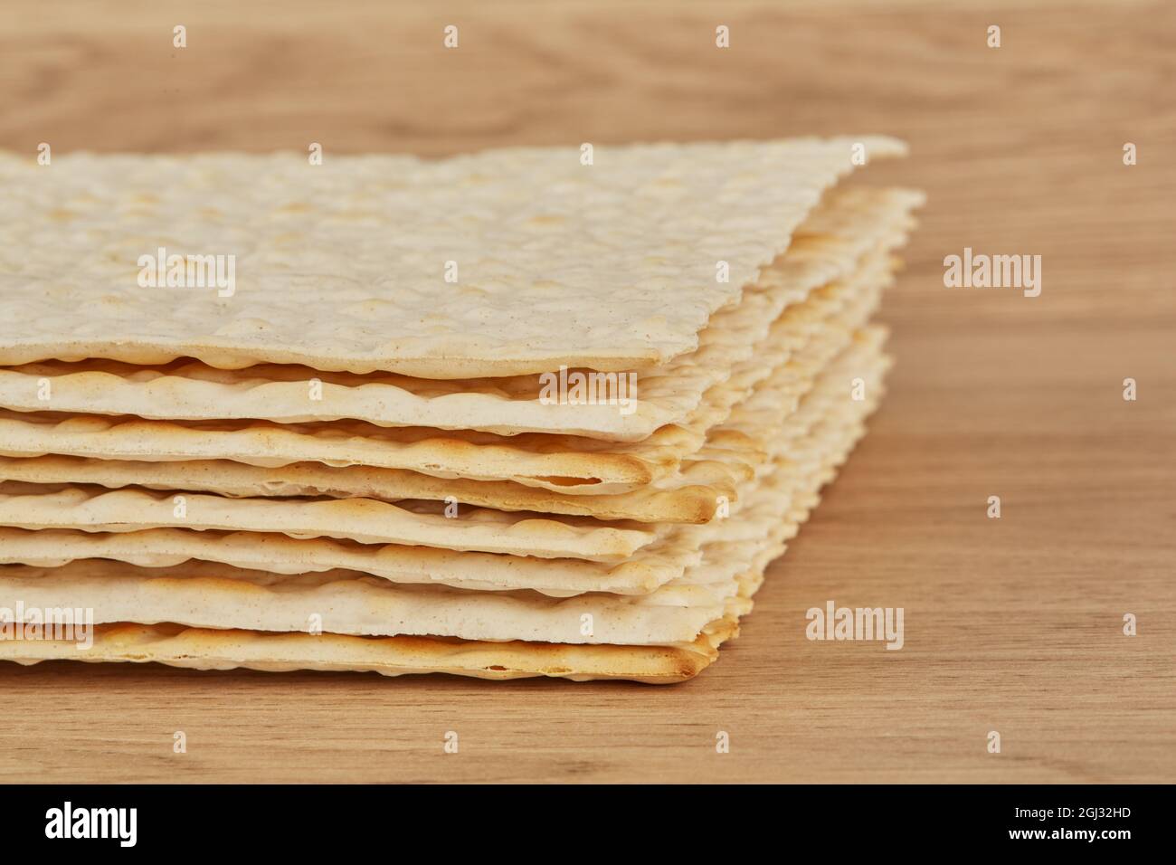 Traditional Jewish matzah for the holiday of Passover lies on a light ...