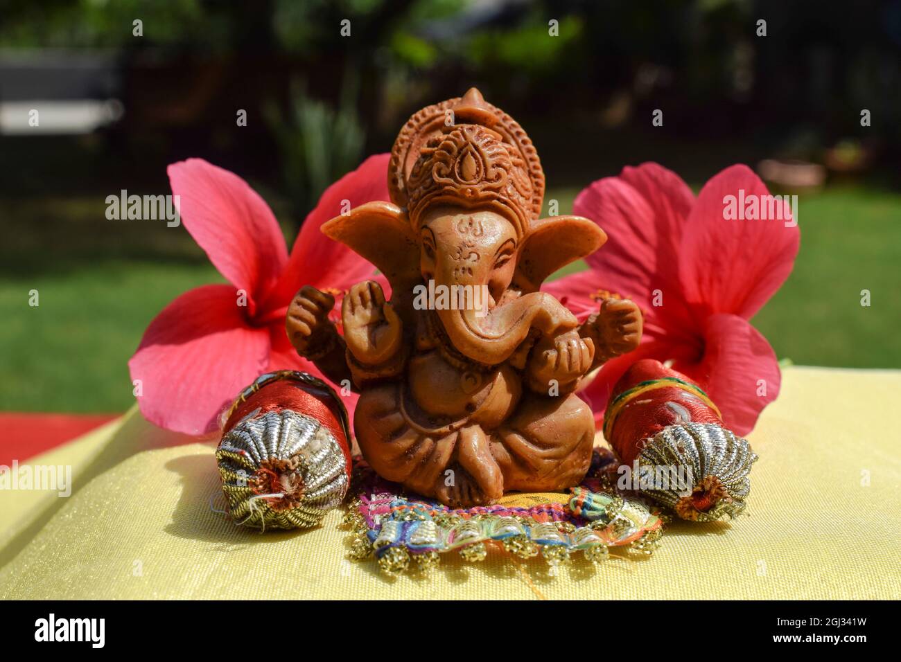 Lord Ganapati sitting idol with pillows and bolsters at home during ...