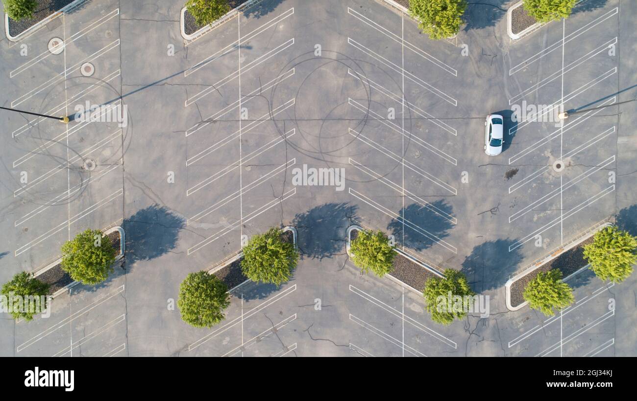 single car working its way through the parking lot to park Stock Photo ...