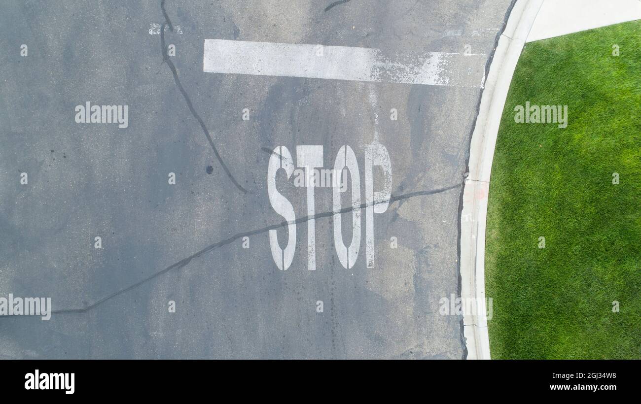 Stop sign on road surface hi-res stock photography and images - Alamy