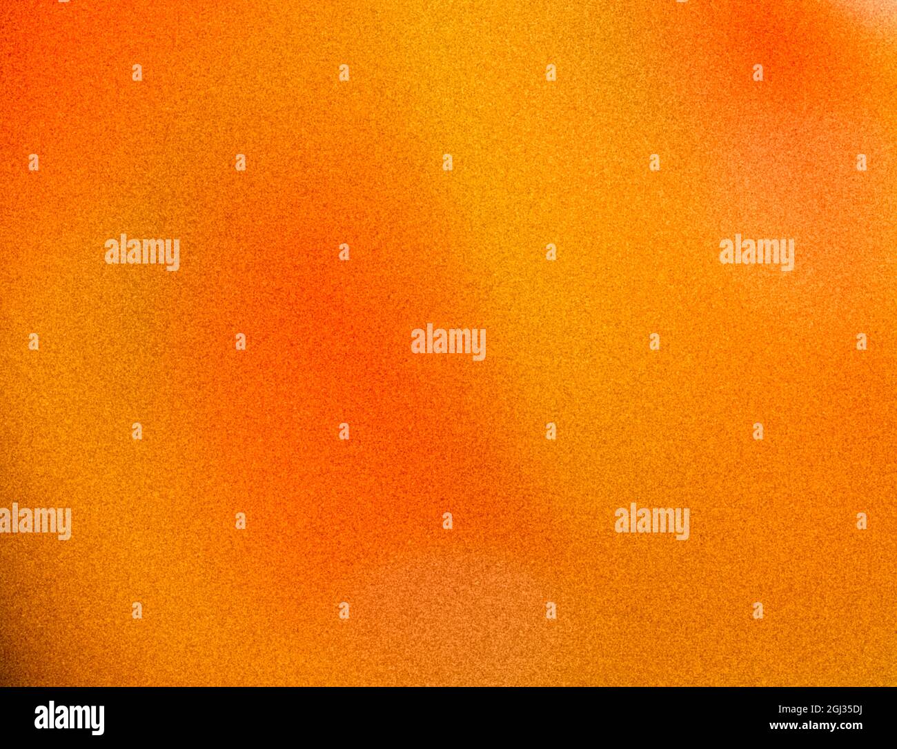 Blurred orange colored background with light degrees, used as a ...