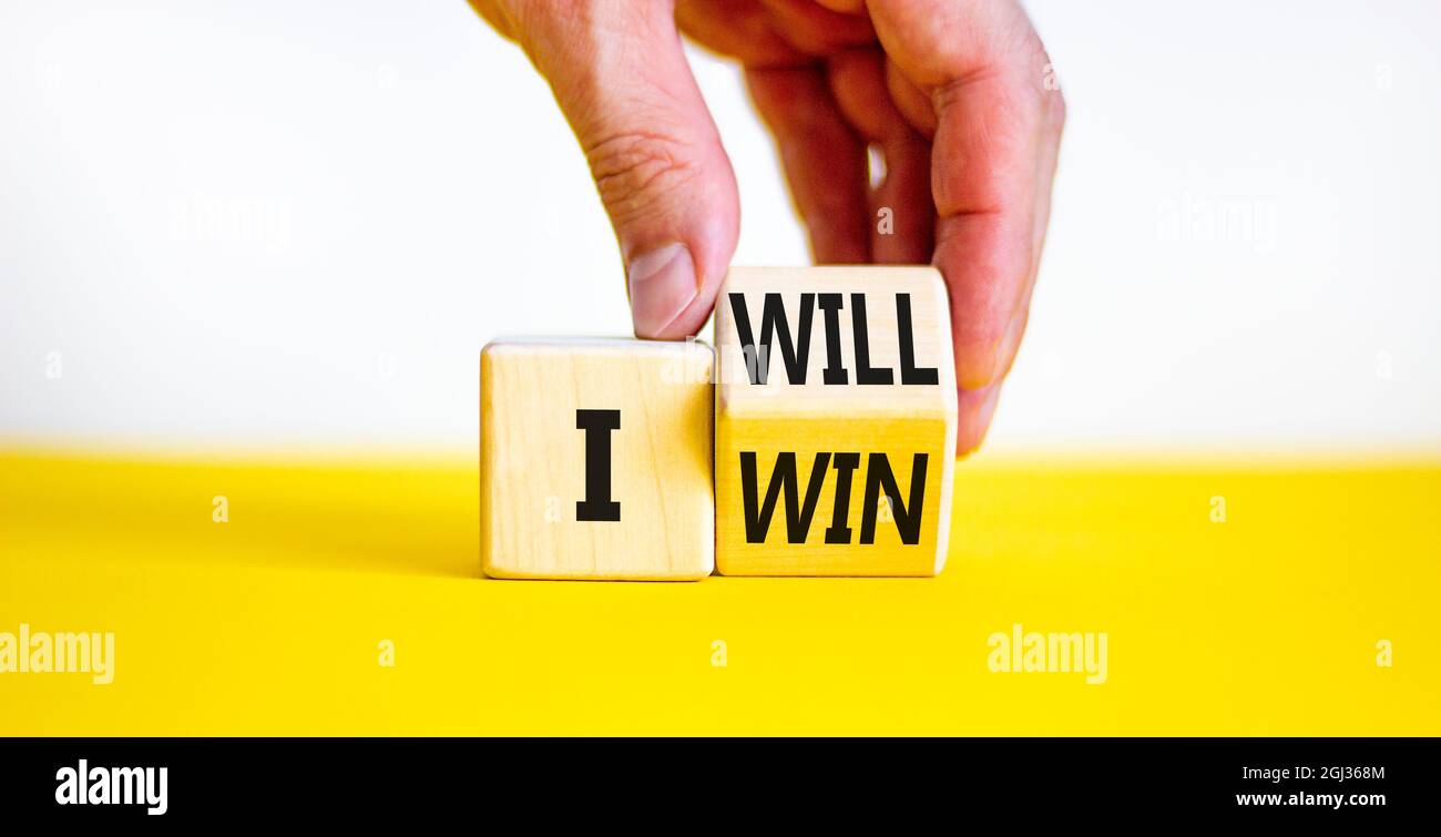 I will win symbol. Businessman turns a cube and changes words i will to ...