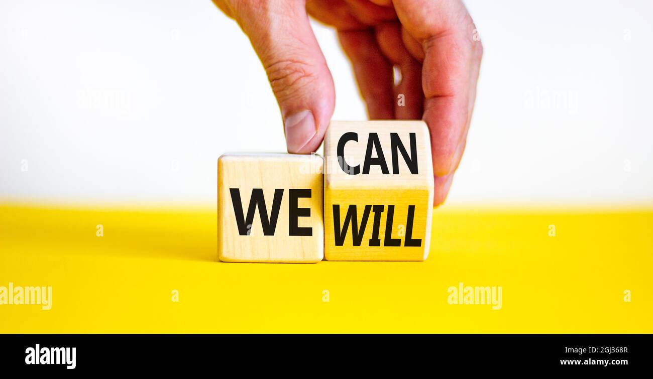 We can and will symbol. Businessman turns a cube and changes words we ...