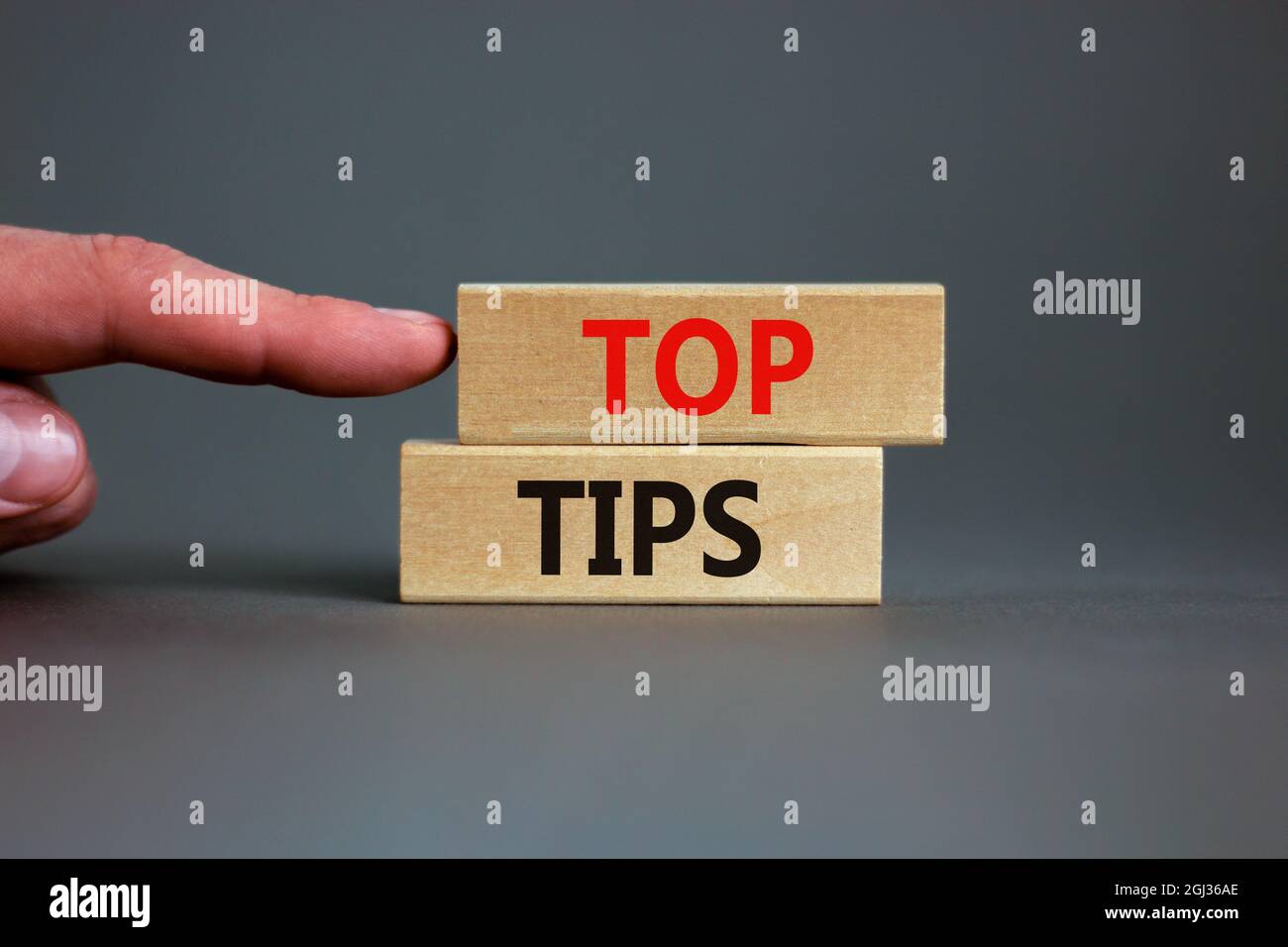 Top tips symbol. Concept words Top tips on wooden blocks on a beautiful ...