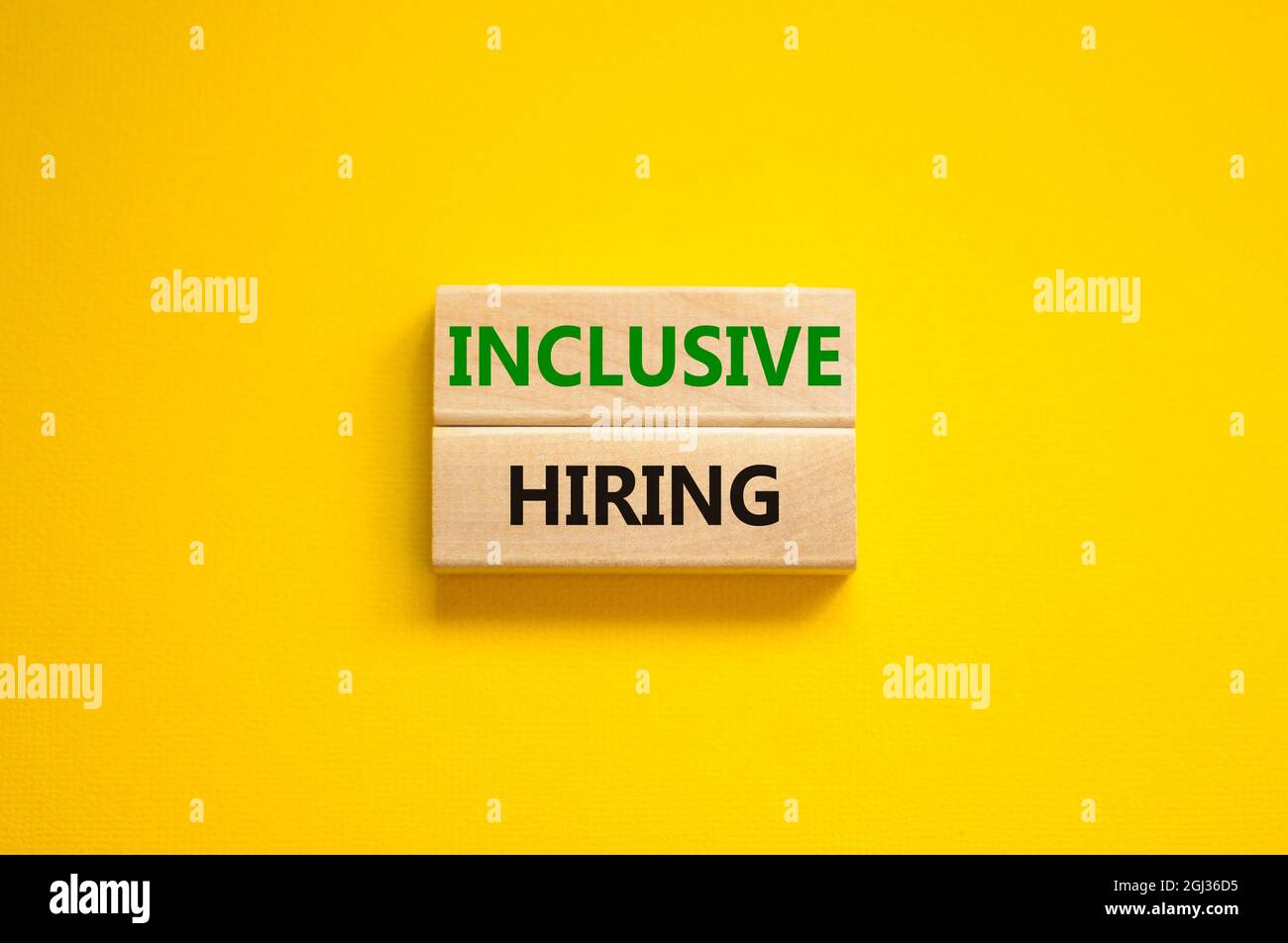 Inclusive hiring symbol. Wooden blocks with words Inclusive hiring on ...