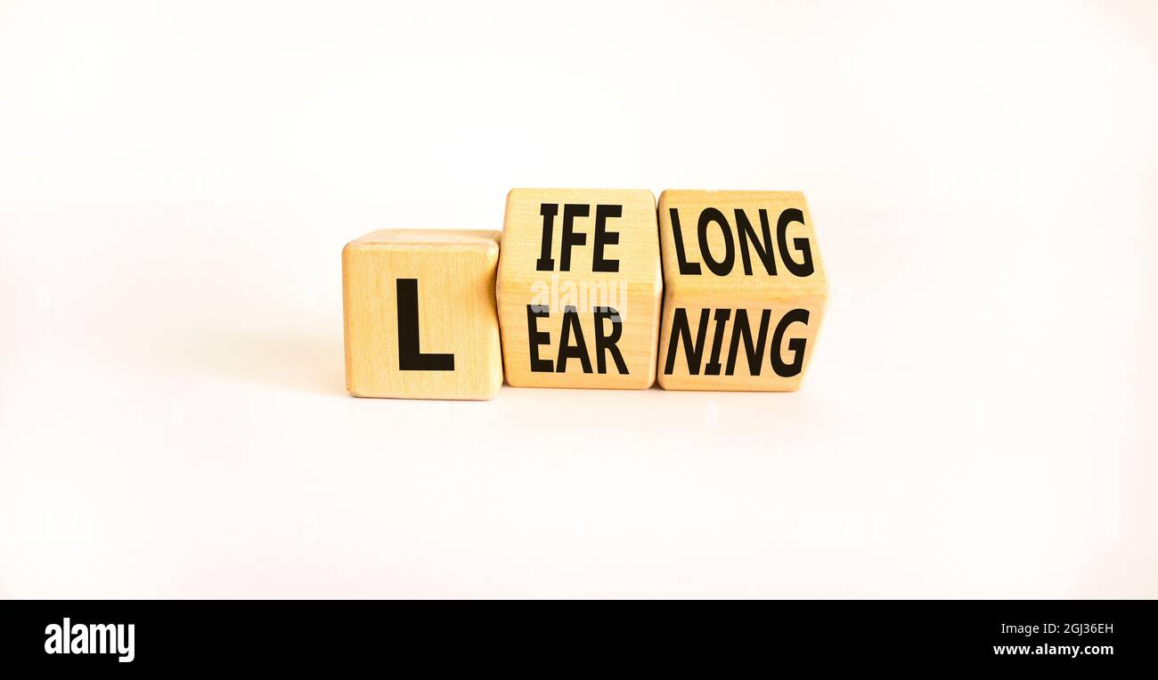 Lifelong learning symbol. Turned wooden cubes with concept words ...