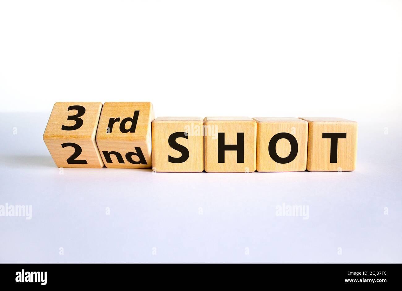 Covid-19 booster vaccine shot symbol. Turned cubes and changed words ...