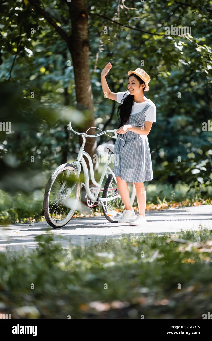 Young asian woman waving hand hi-res stock photography and images - Alamy