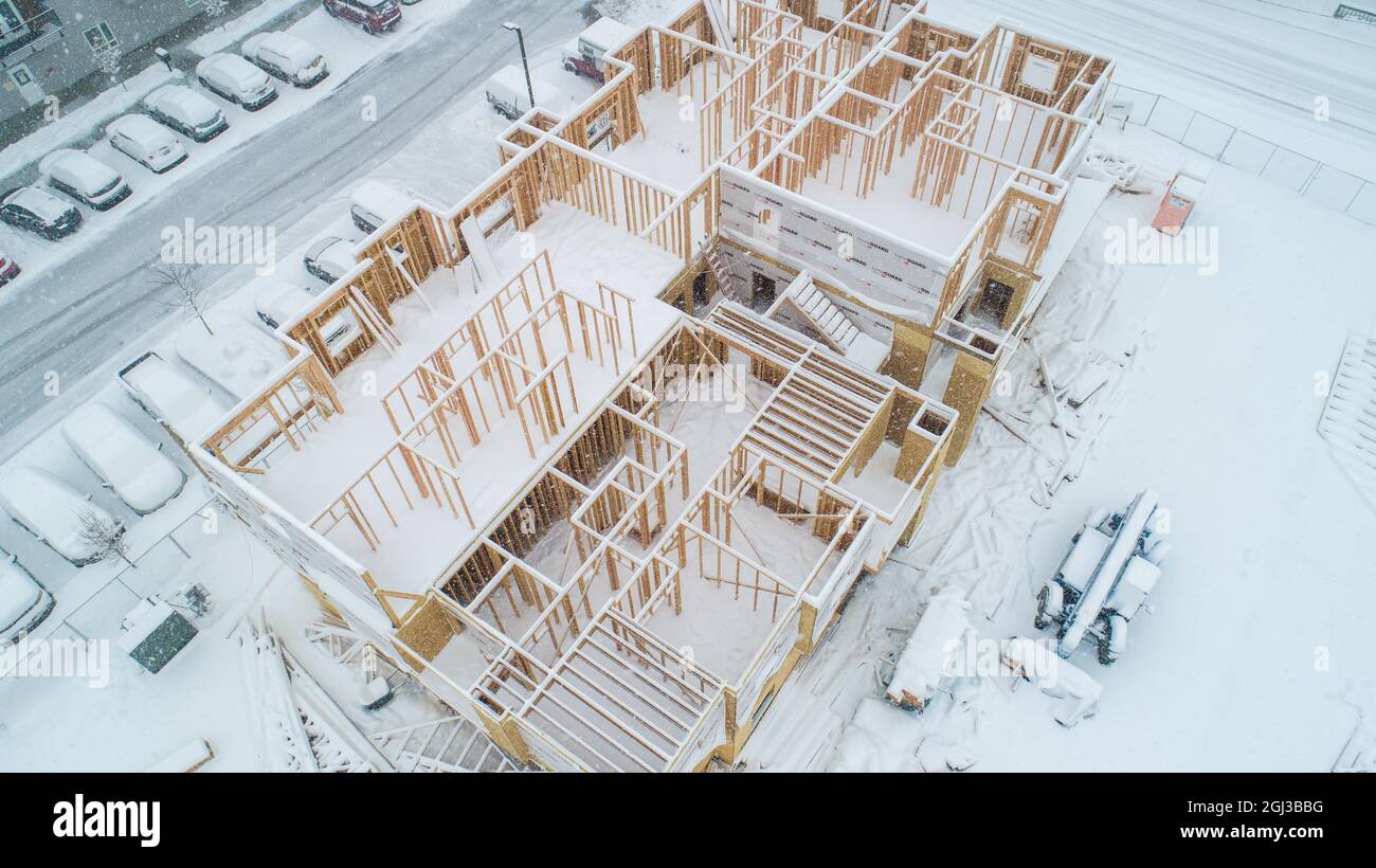 aerial view of a new apartment building going up to keep up with demand ...