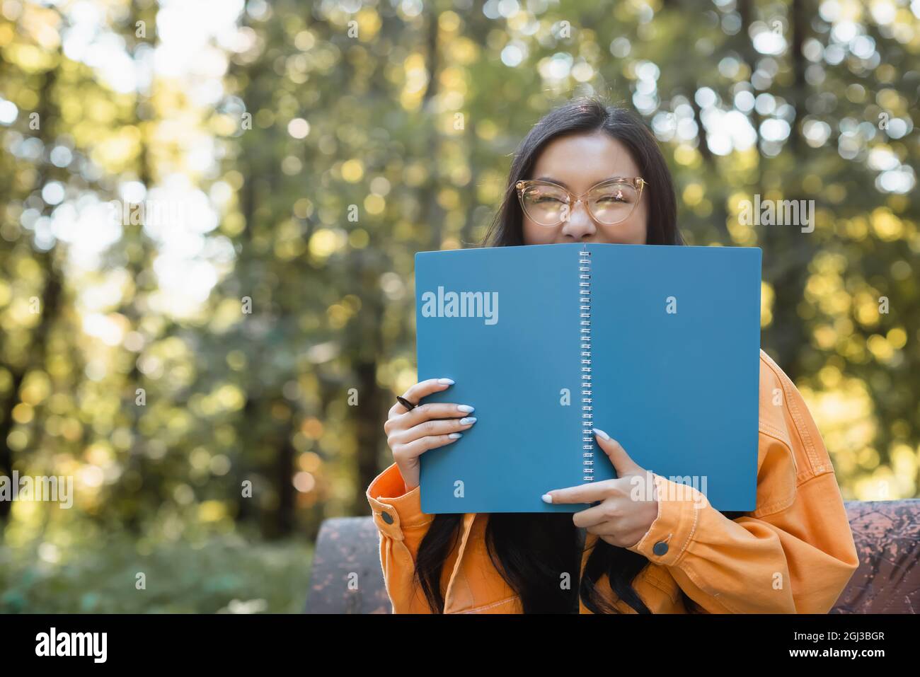 Cheerful asian student book hi-res stock photography and images - Alamy