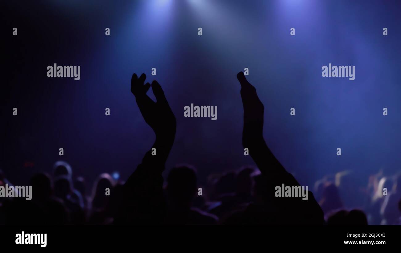 Person is clapping during concert Stock Photo - Alamy