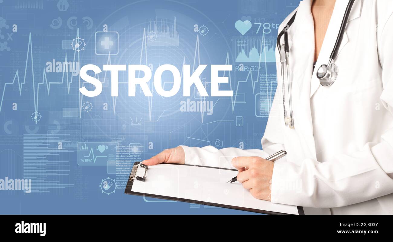 young doctor writing down notes Stock Photo - Alamy