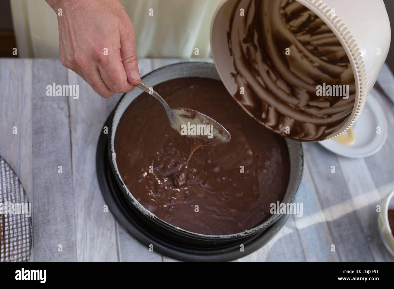 Cake making process. The dough is ready. The cook puts the finished ...