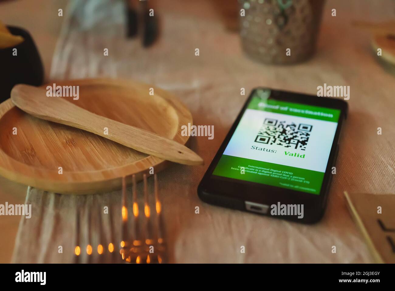 Smartphone app with certificate of immunization in restaurant. Status ...
