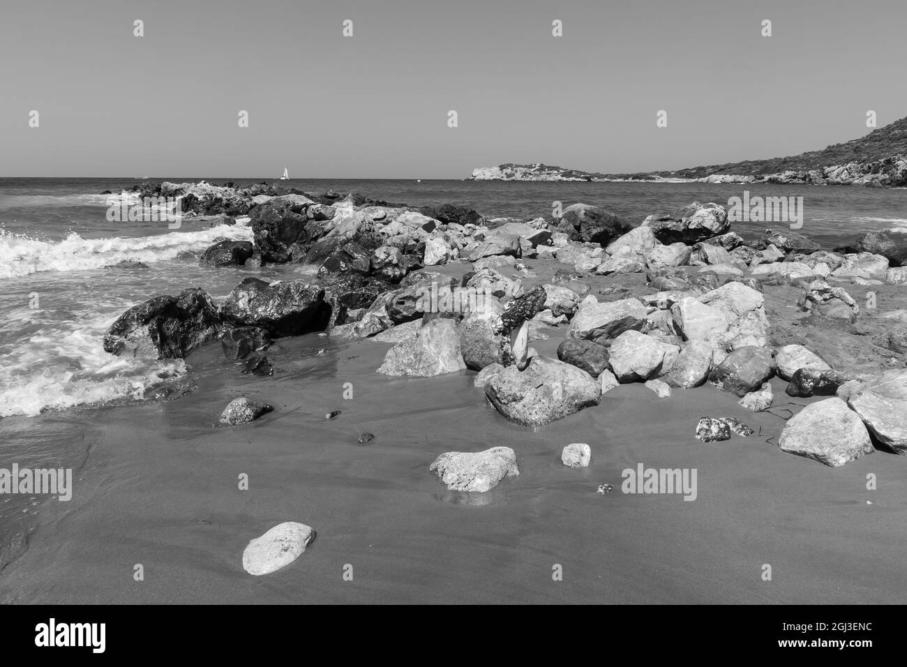 Grayscale shot of a rocky beach Stock Photo - Alamy