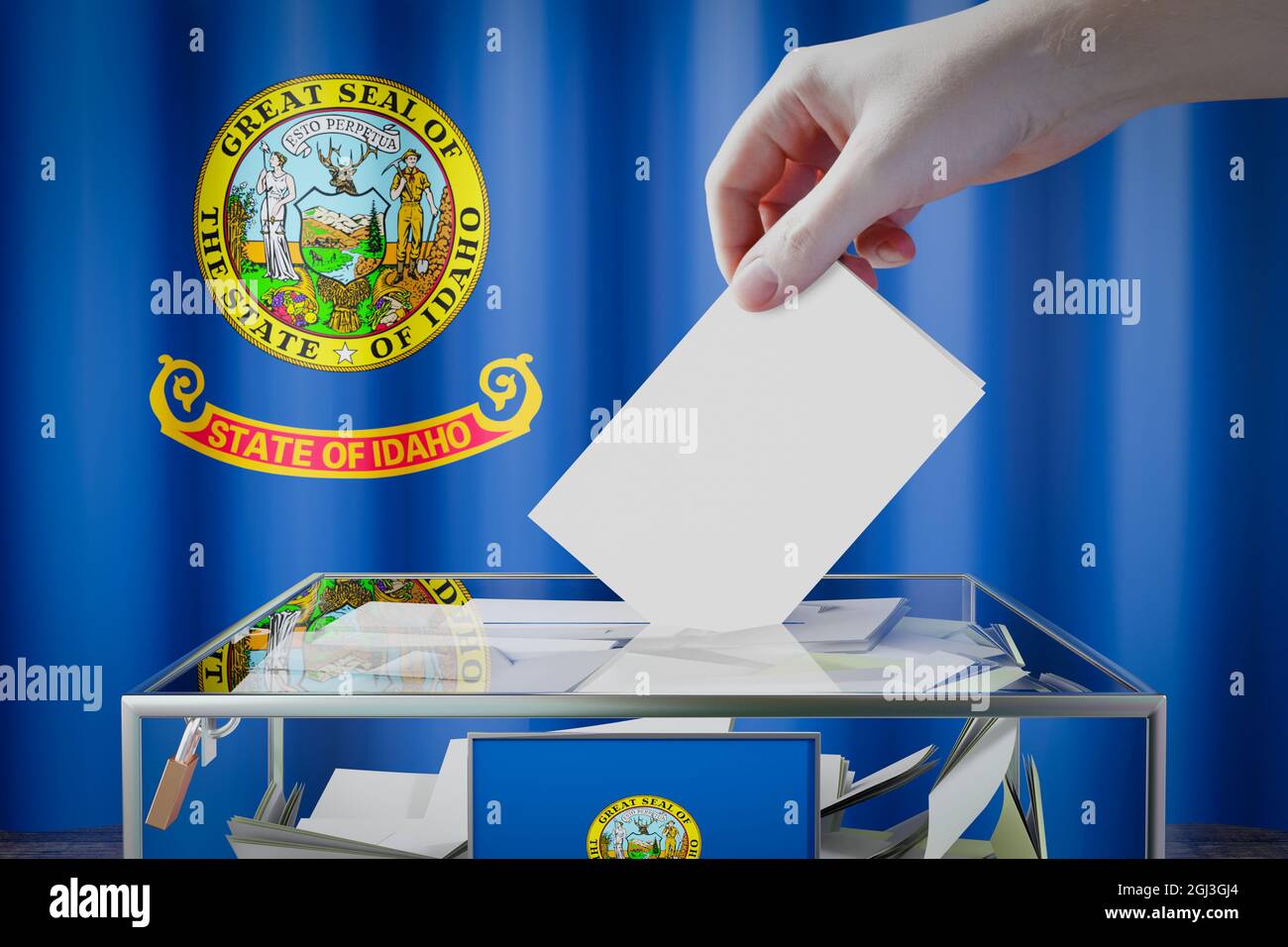 Idaho flag, hand dropping ballot card into a box - voting, election ...