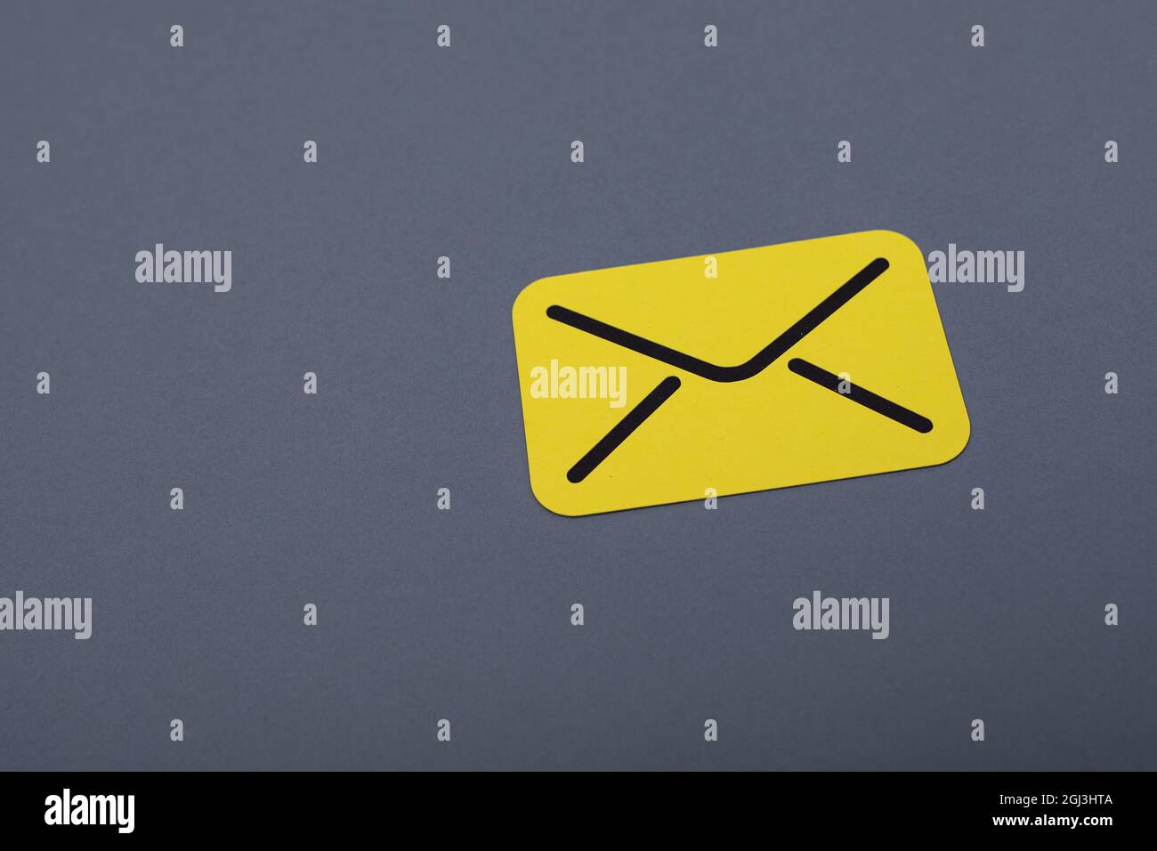 2D illustration of a vibrant neon message icon on a gray background ...