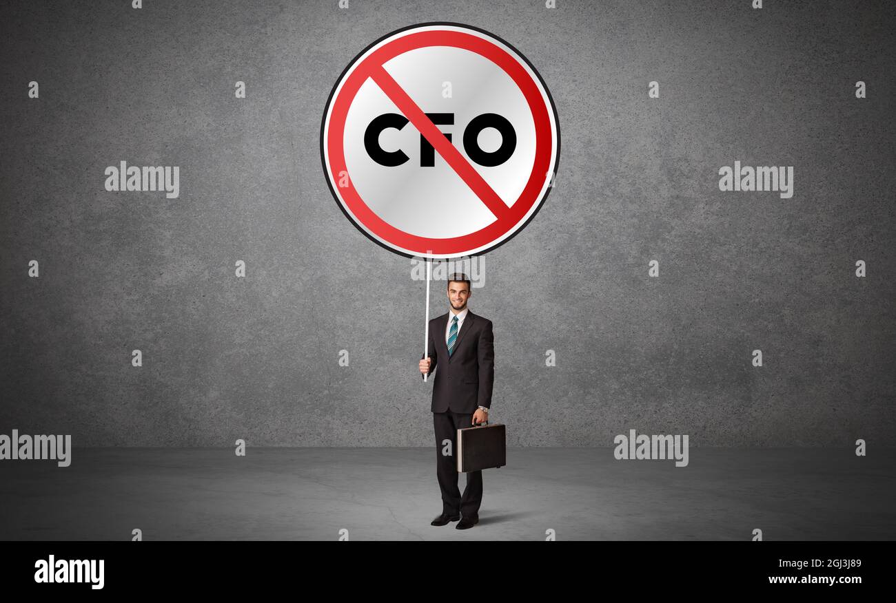 Young business person holdig traffic sign Stock Photo - Alamy
