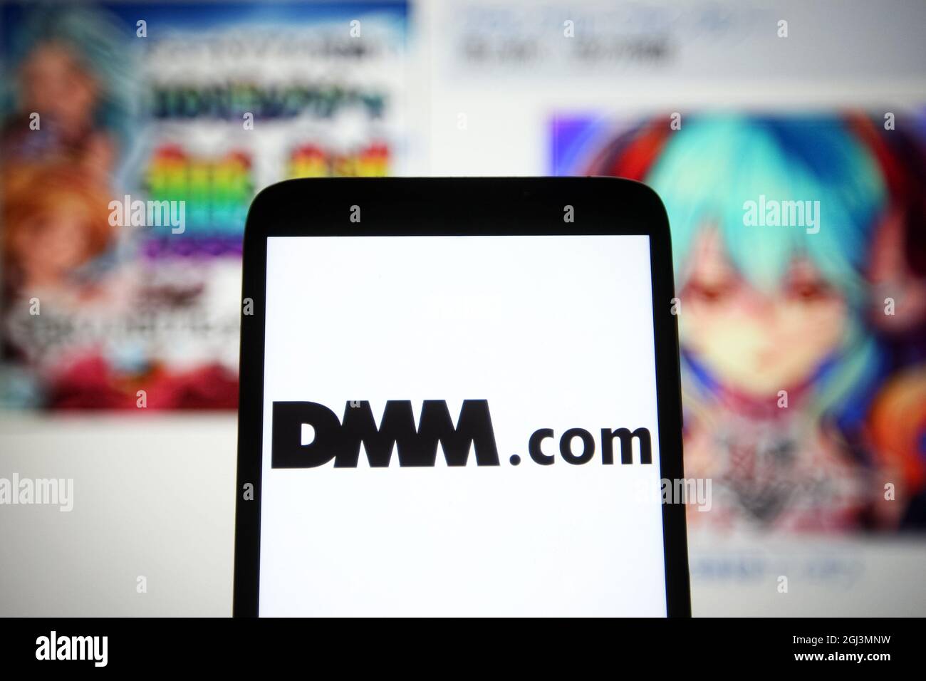 In this photo illustration a DMM.com Ltd logo is seen on a smartphone ...
