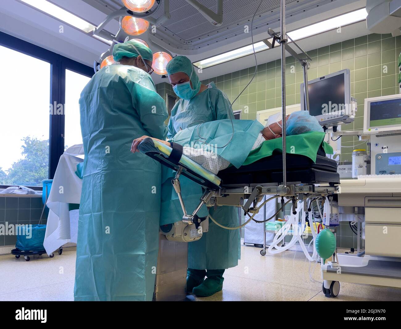 urological surgery is performed in an operating room in a hospital ...