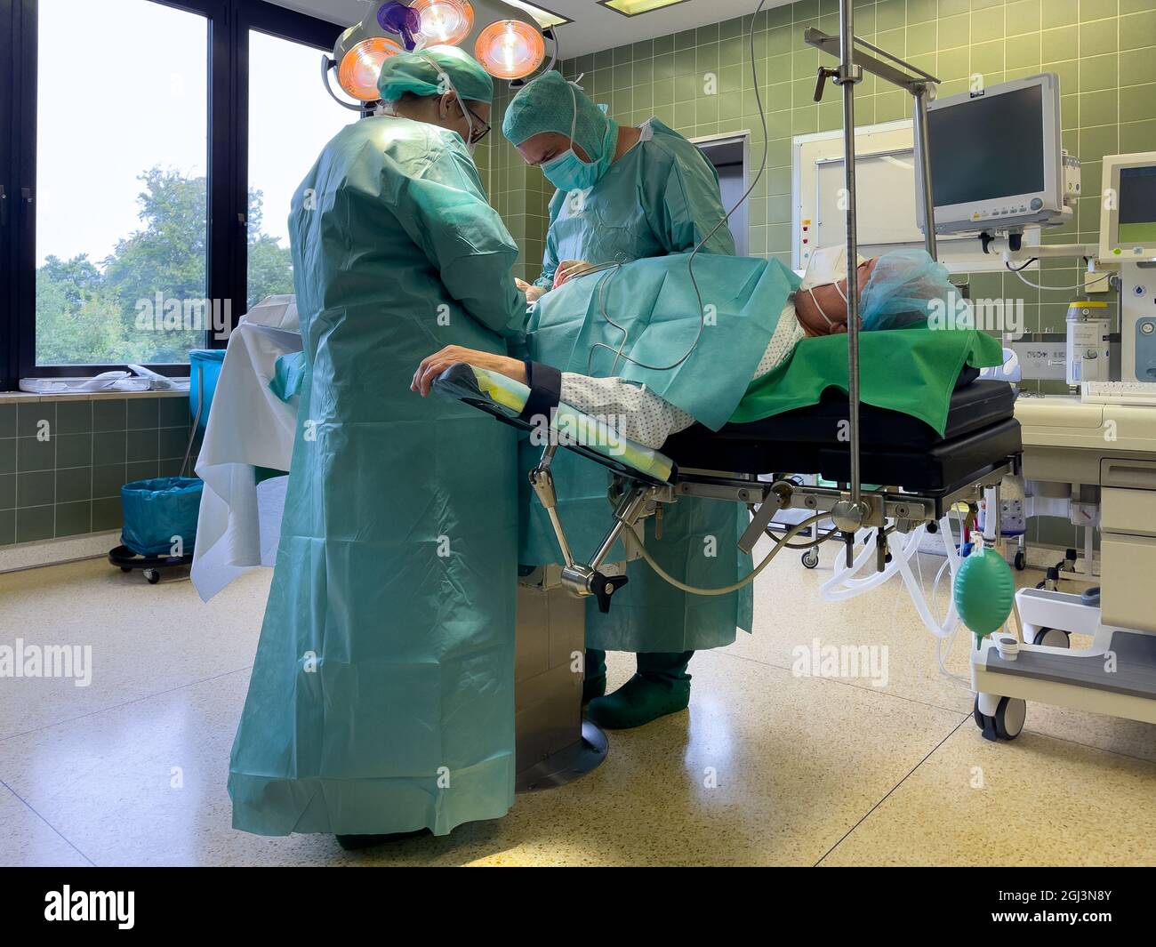 urological surgery is performed in an operating room in a hospital ...