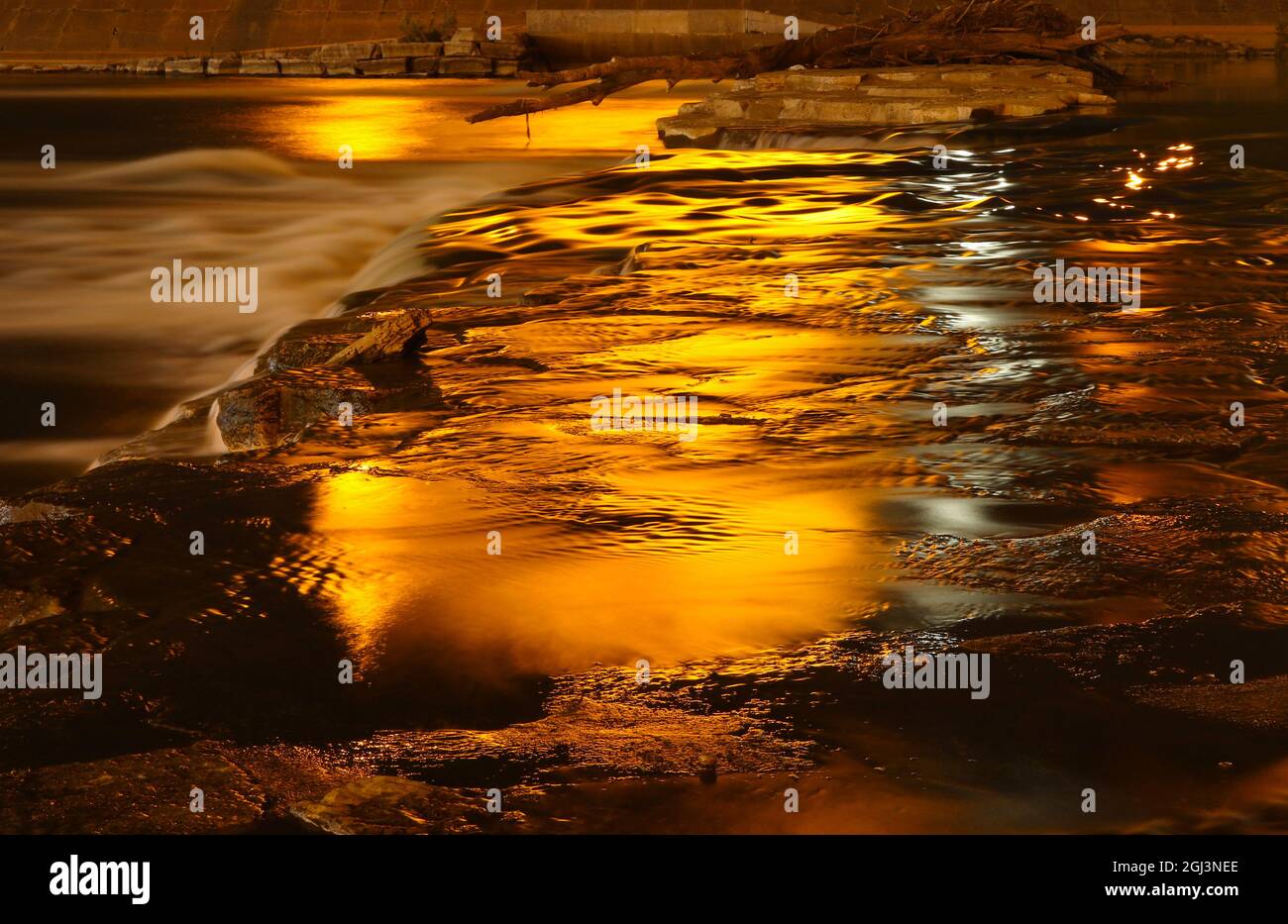 Night reflections on the Miami River. Light provided from the Dayton ...
