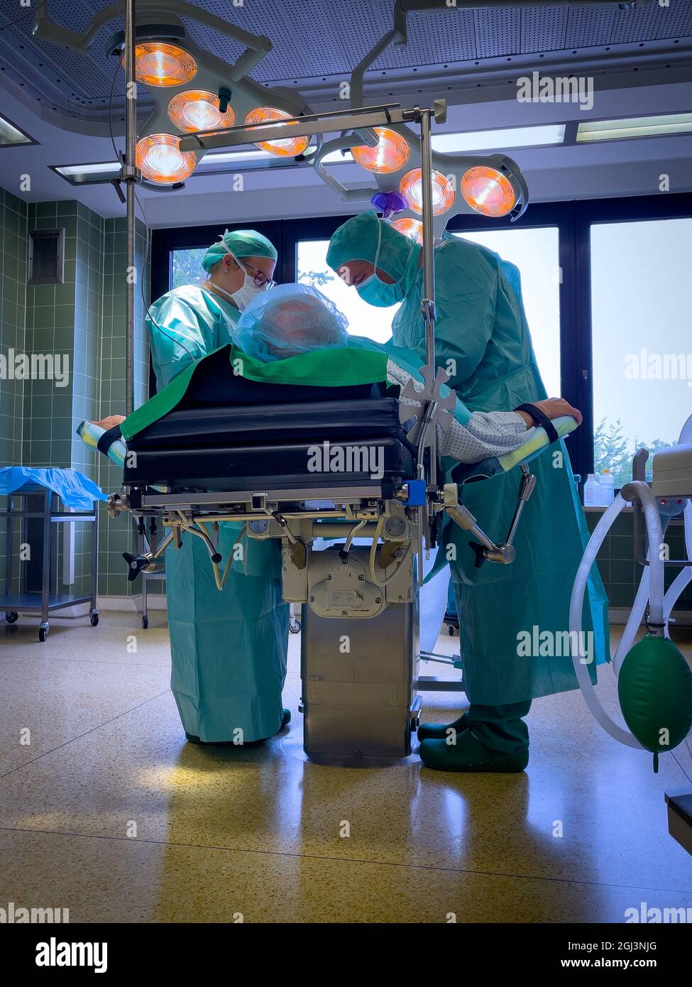 urological surgery is performed in an operating room in a hospital ...
