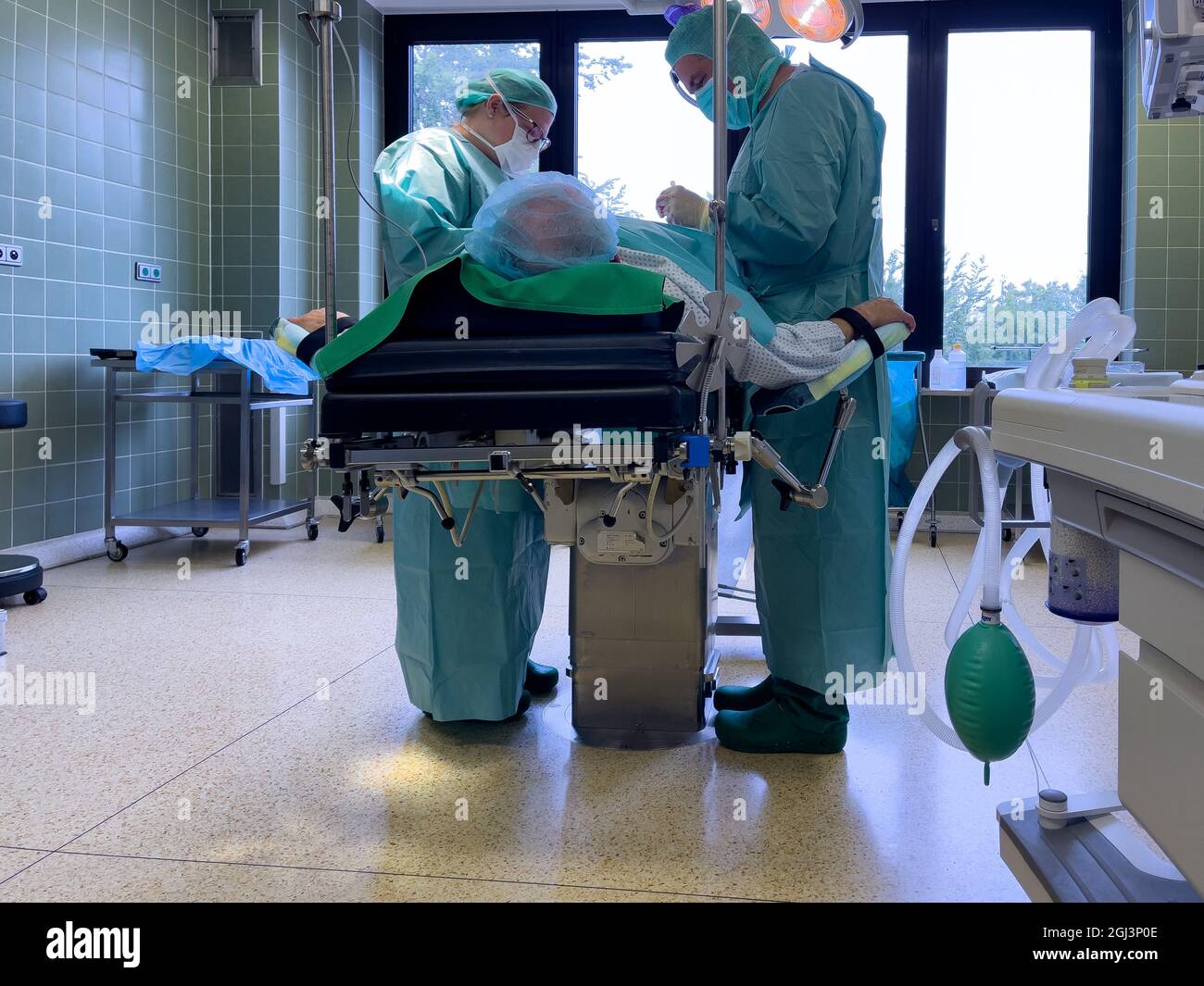 urological surgery is performed in an operating room in a hospital ...
